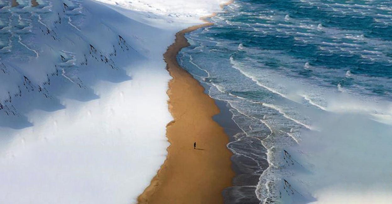 മഞ്ഞും മണലും കടലും ഒരുമിച്ച്; സമൂഹമാധ്യമത്തിൽ വൈറലായ ആ ബീച്ച് ഇവിടെയാണ് ...